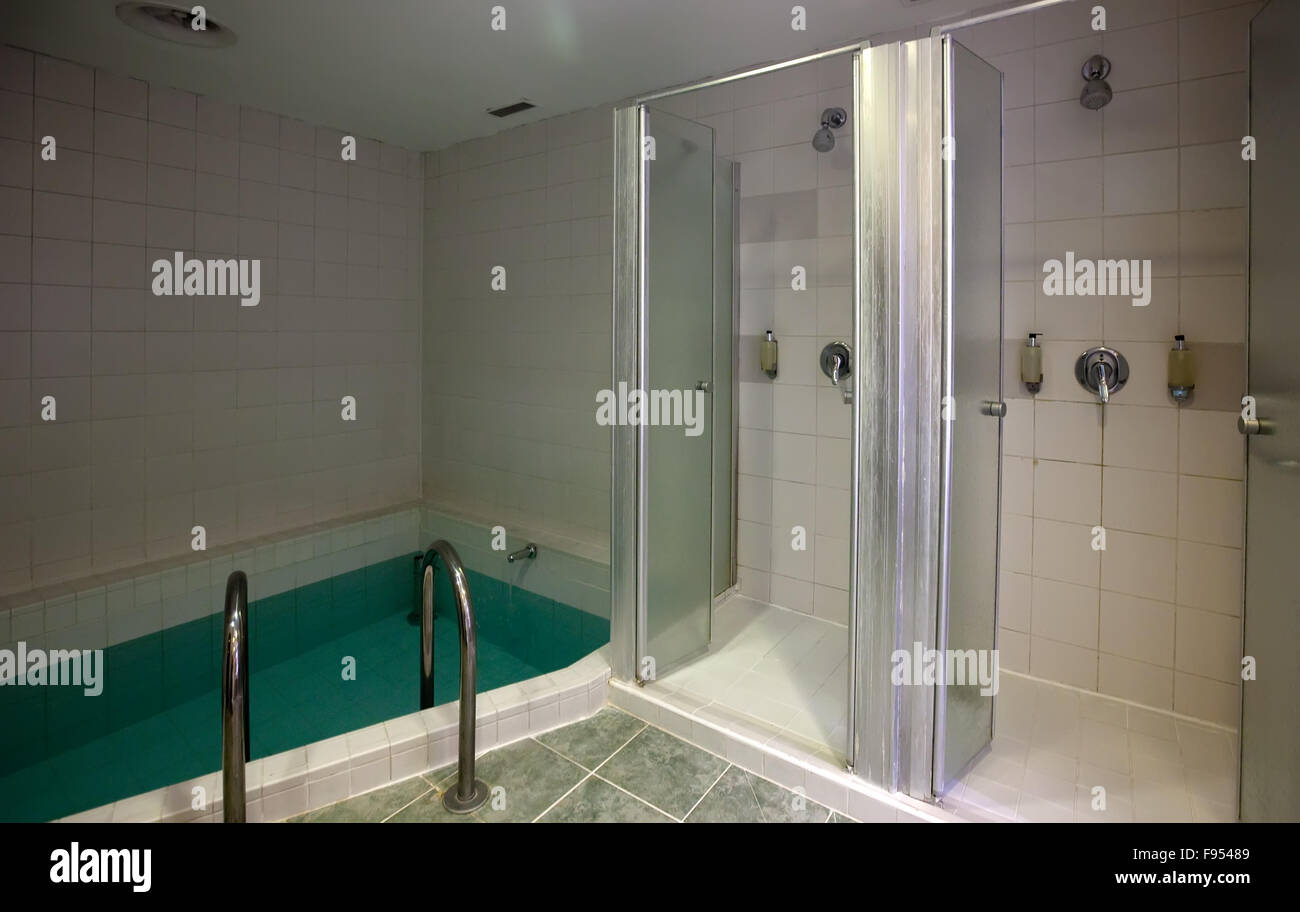 Interior of swimming pool with shower Stock Photo - Alamy