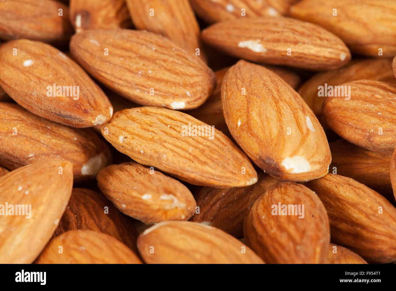 Many almond nuts, may be used as background Stock Photo - Alamy