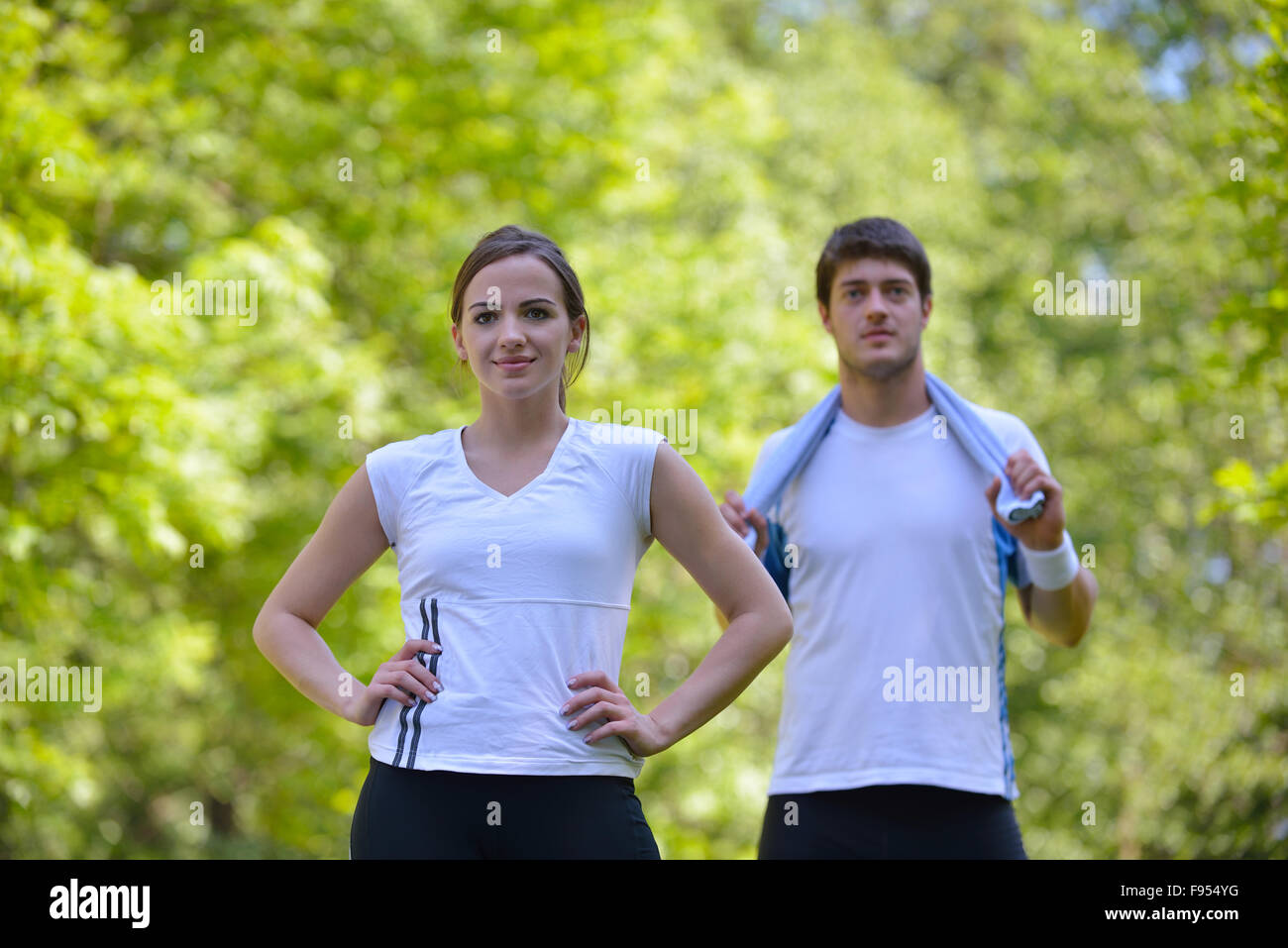 young health couple doing stretching exercise relaxing and warm up ...