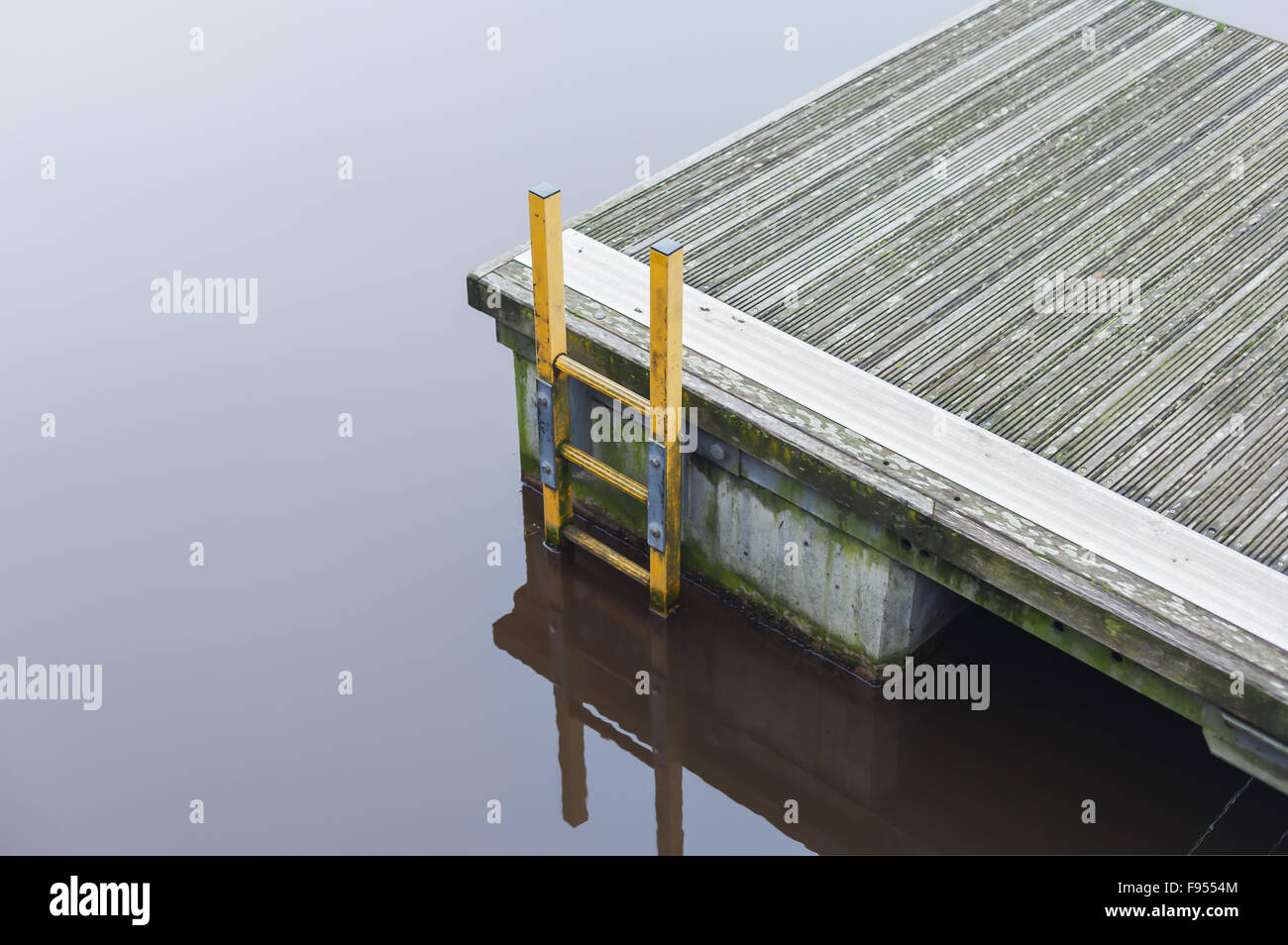 Ladder on pier Stock Photo - Alamy