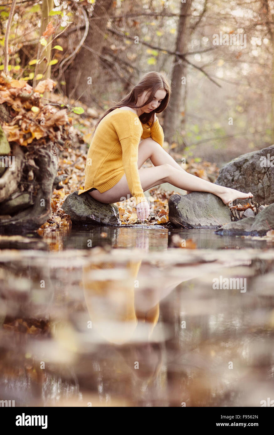 Outdoor portrait of beautiful girl in autumn forest Stock Photo - Alamy
