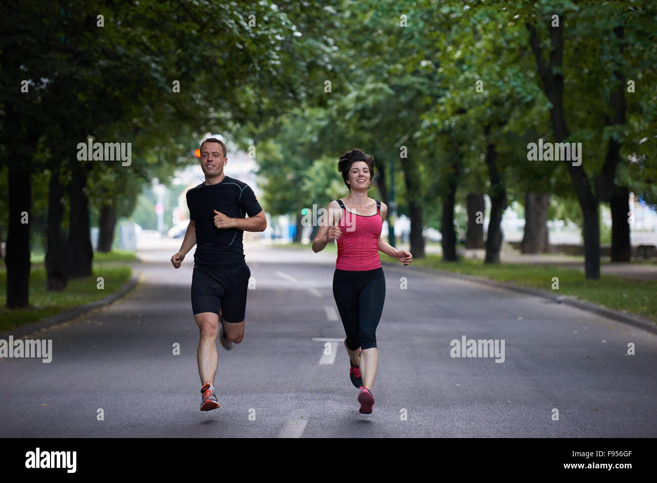 urban sports healthy couple jogging Stock Photo - Alamy