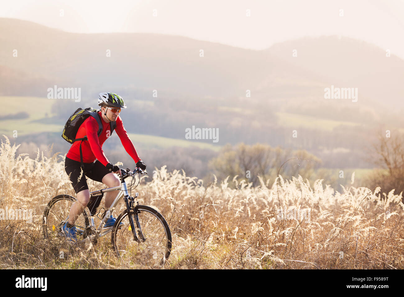 cyclist man riding mountain bike on outdoor trail in nature Stock Photo ...