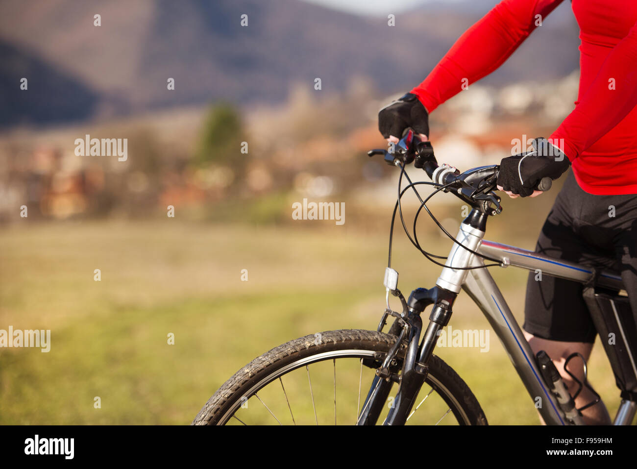 Detail of cyclist man riding mountain bike on outdoor trail in nature ...