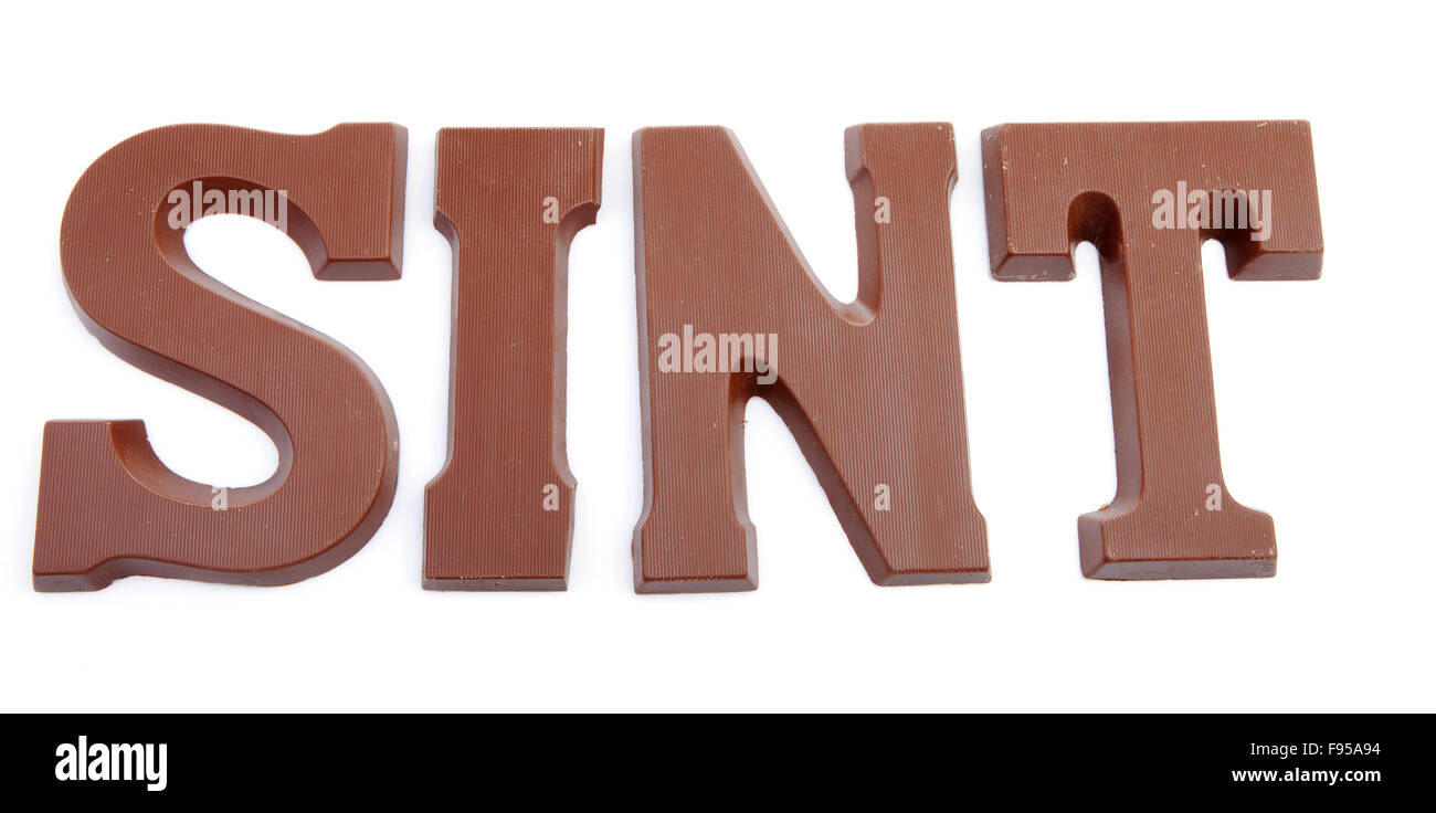 The word "SINT" in chocolate letters isolated on white background ...