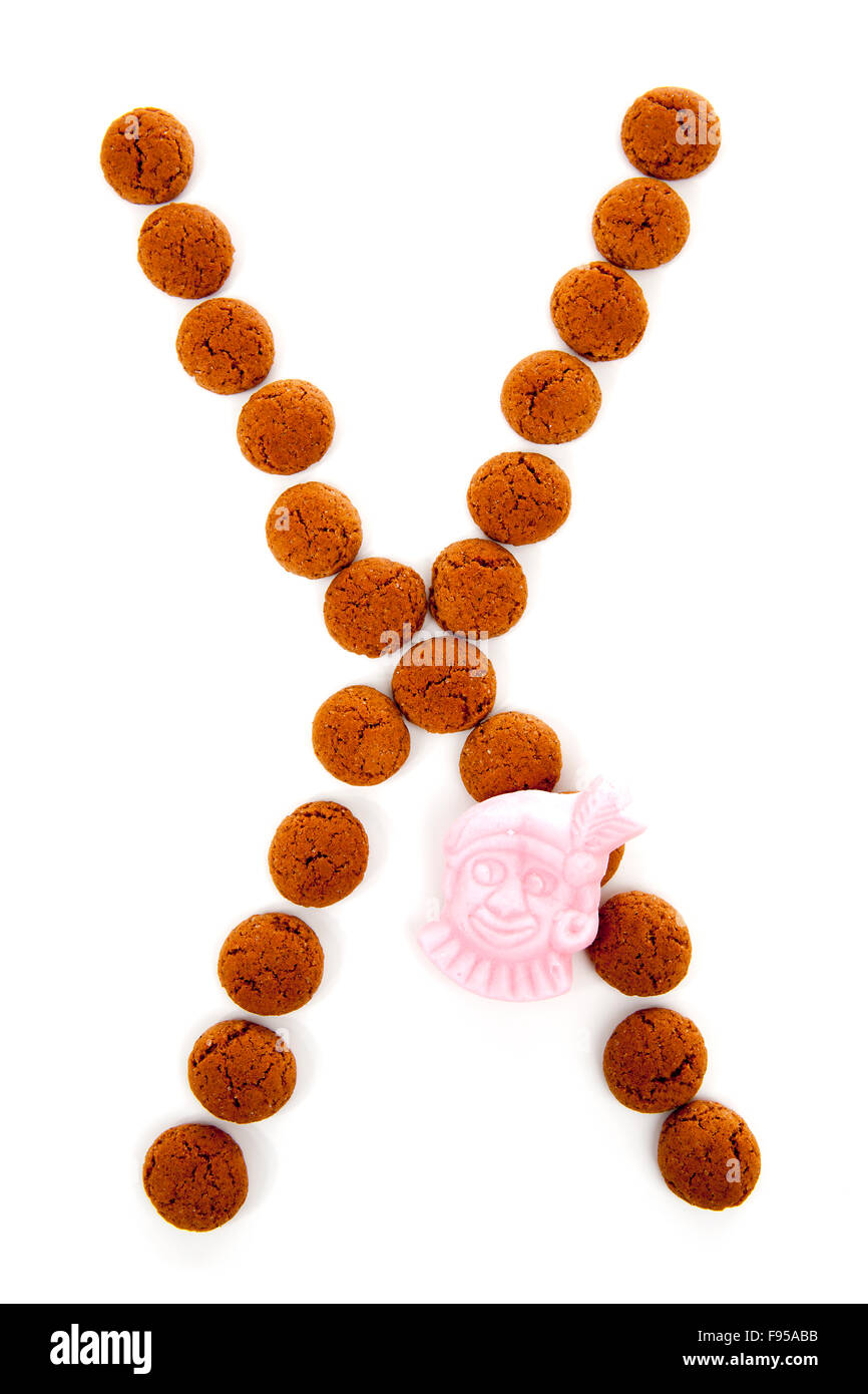 Ginger nuts, pepernoten, in the shape of letter X isolated on white ...
