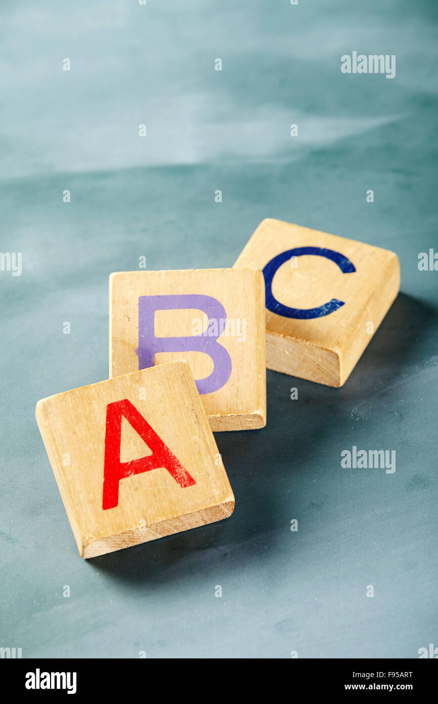 wooden square block abc on the blackboard Stock Photo - Alamy
