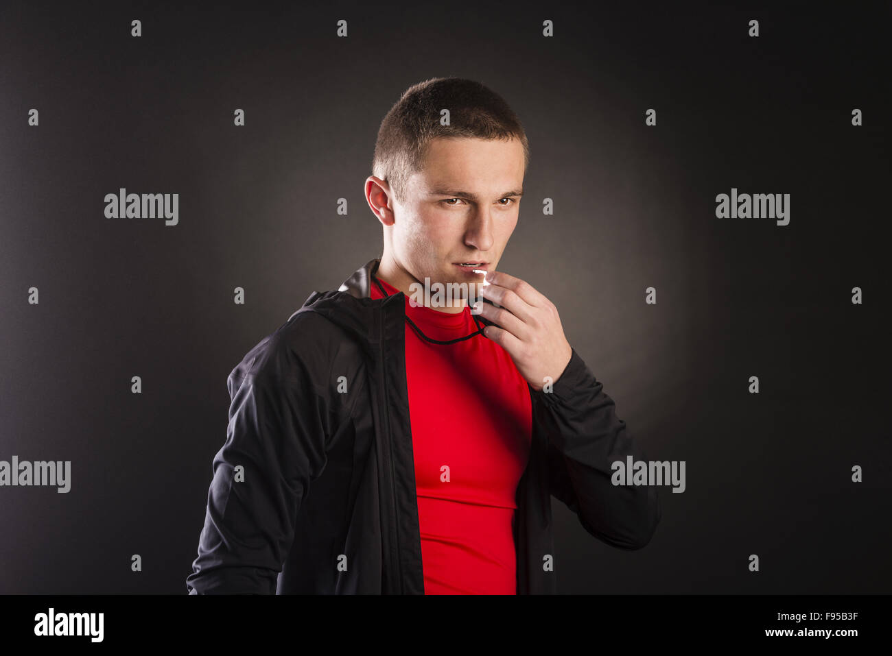 Professional fitness coach isolated on black background Stock Photo - Alamy