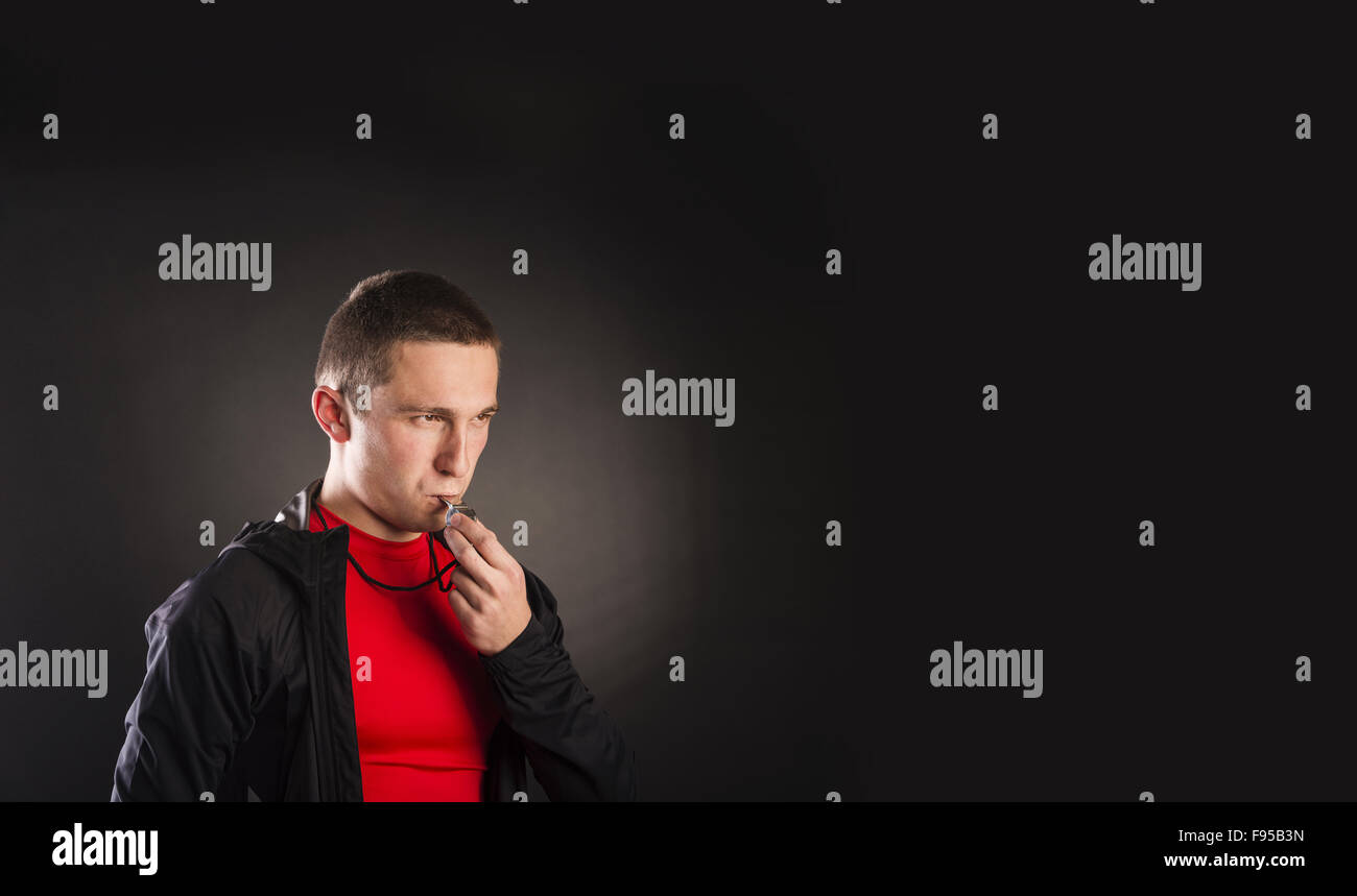 Professional fitness coach isolated on black background Stock Photo - Alamy