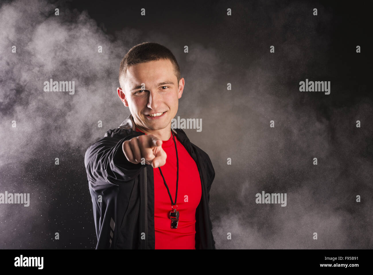 Professional fitness coach isolated on black background Stock Photo - Alamy