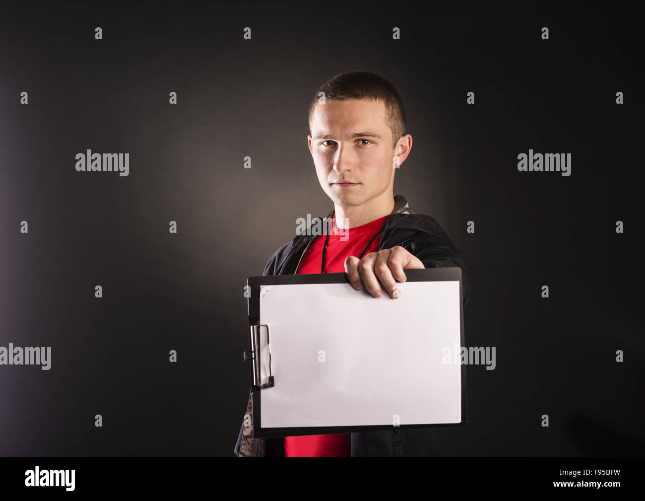 Professional fitness coach isolated on black background Stock Photo - Alamy