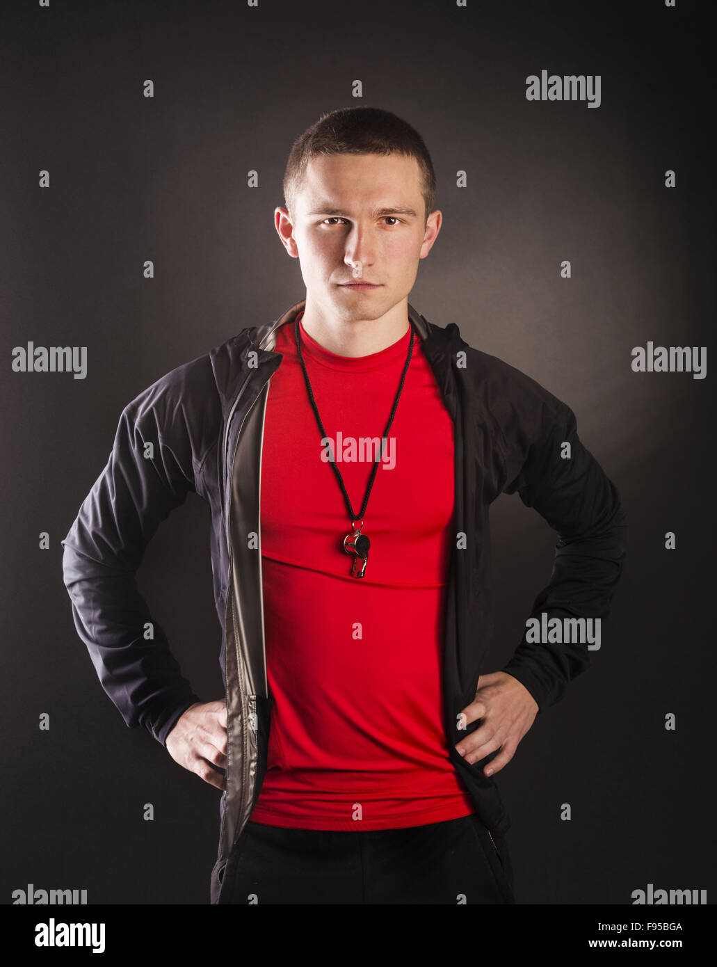 Professional fitness coach isolated on black background Stock Photo - Alamy