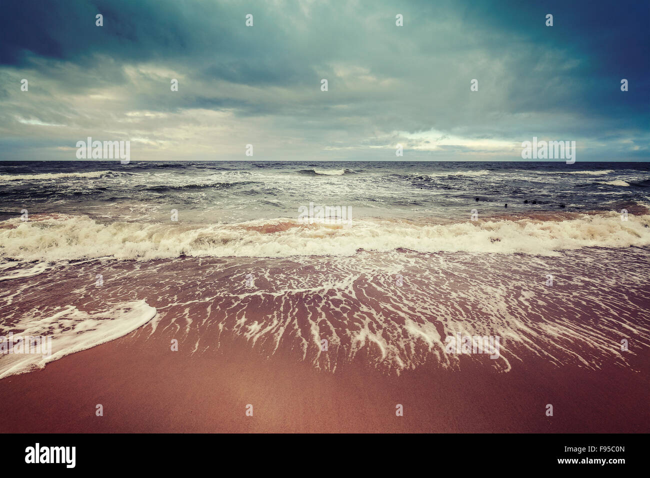 Vintage toned stormy sky over rough sea, calm before the storm concept ...