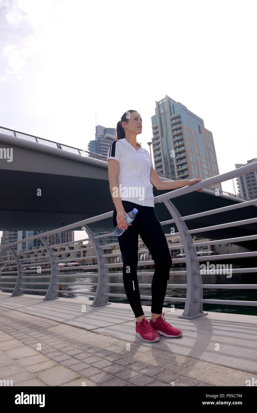 Running in city park. Woman runner outside jogging at morning with ...