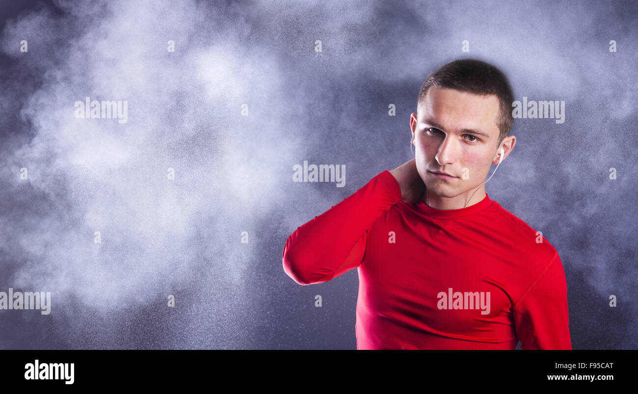 Young fitness athlete is posing in studio with black background Stock ...