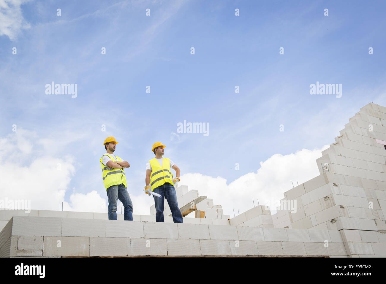 Construction Contractors building a big new home Stock Photo - Alamy