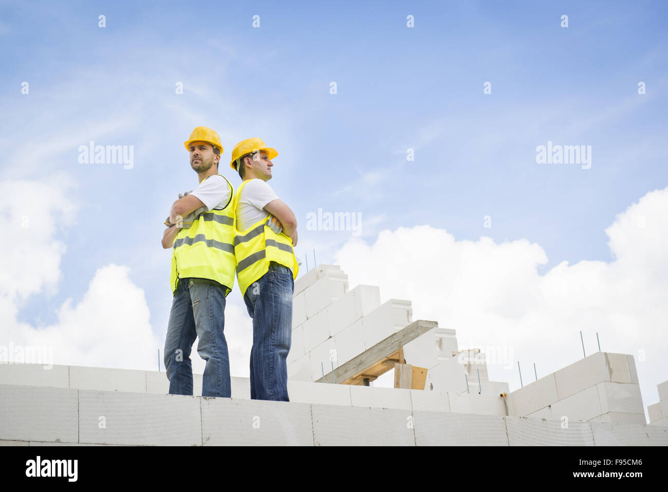 Construction Contractors building a big new home Stock Photo - Alamy