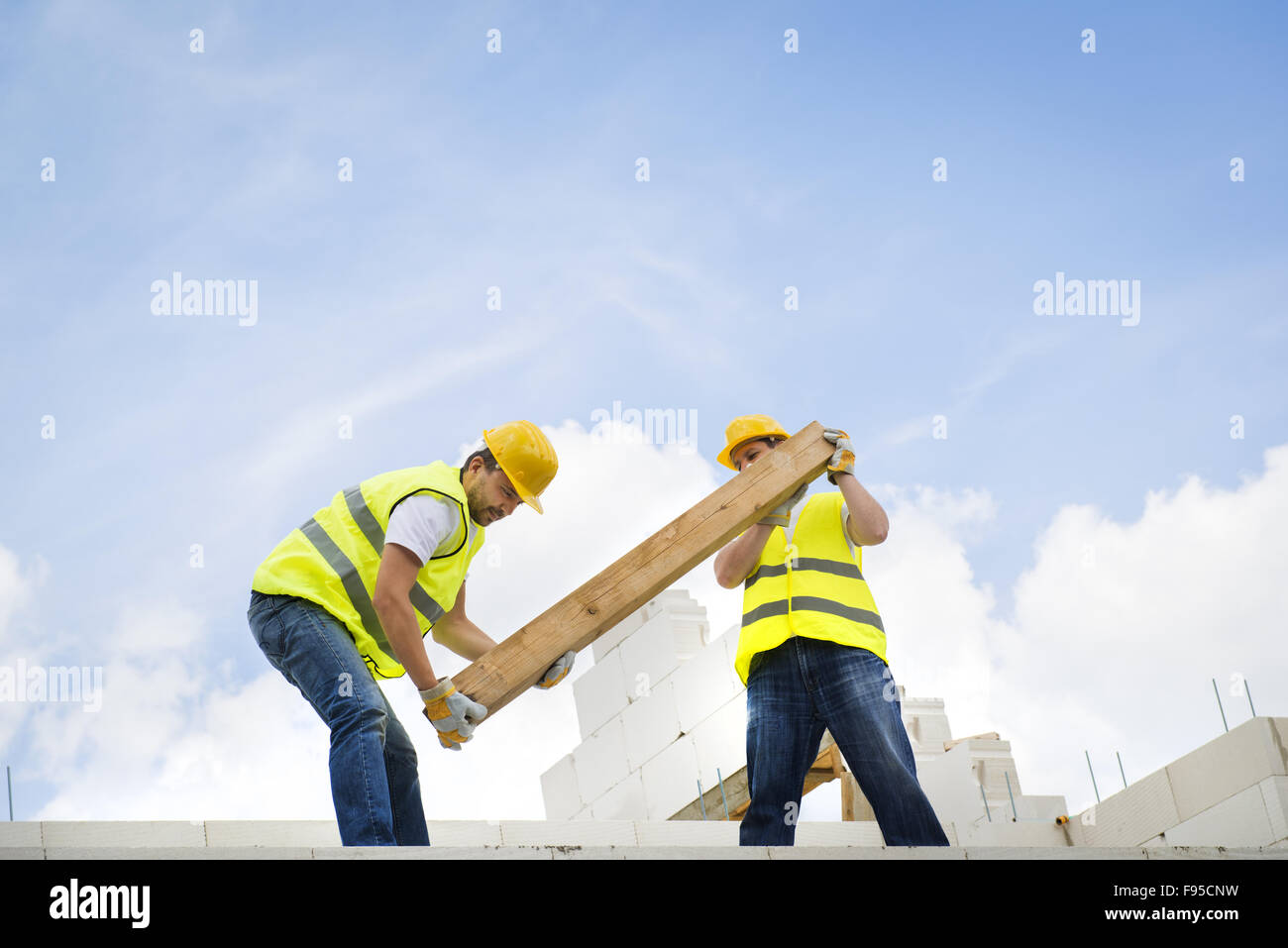 Construction Contractors building a big new home Stock Photo - Alamy