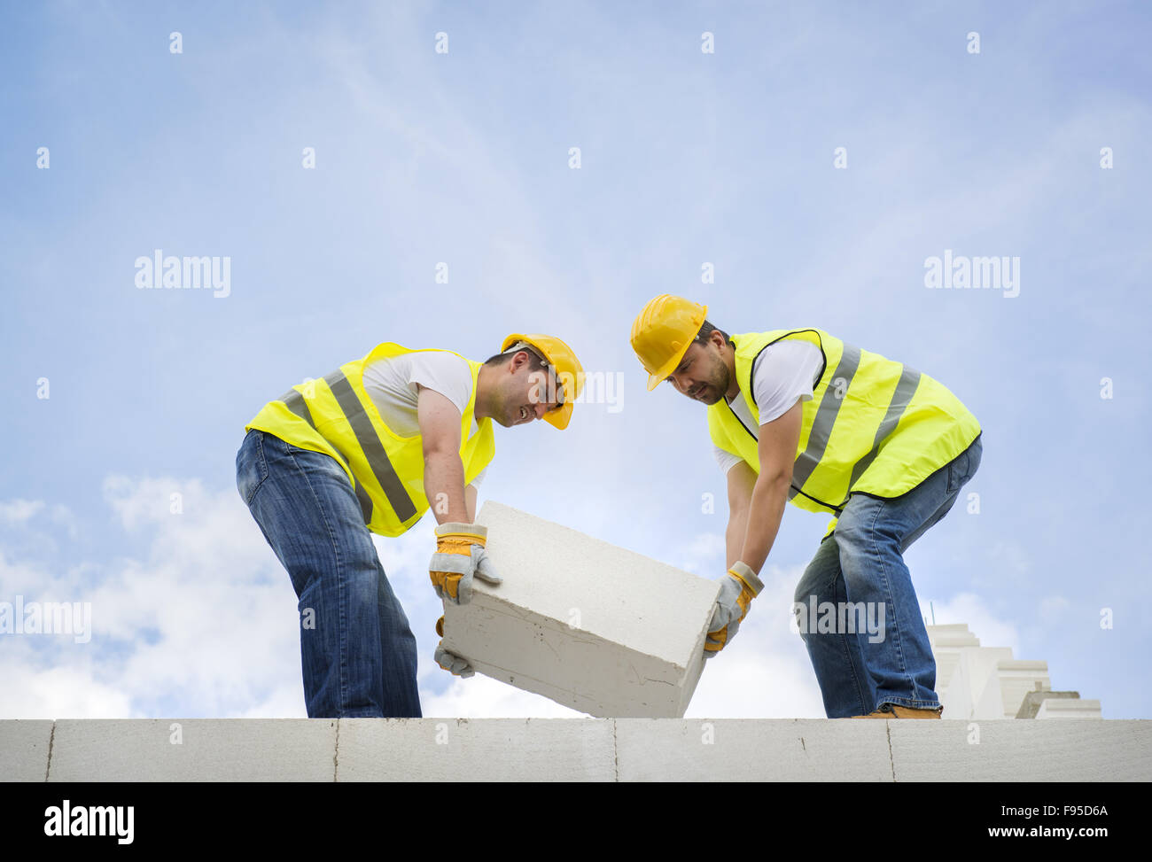 Construction Contractors building a big new home Stock Photo - Alamy