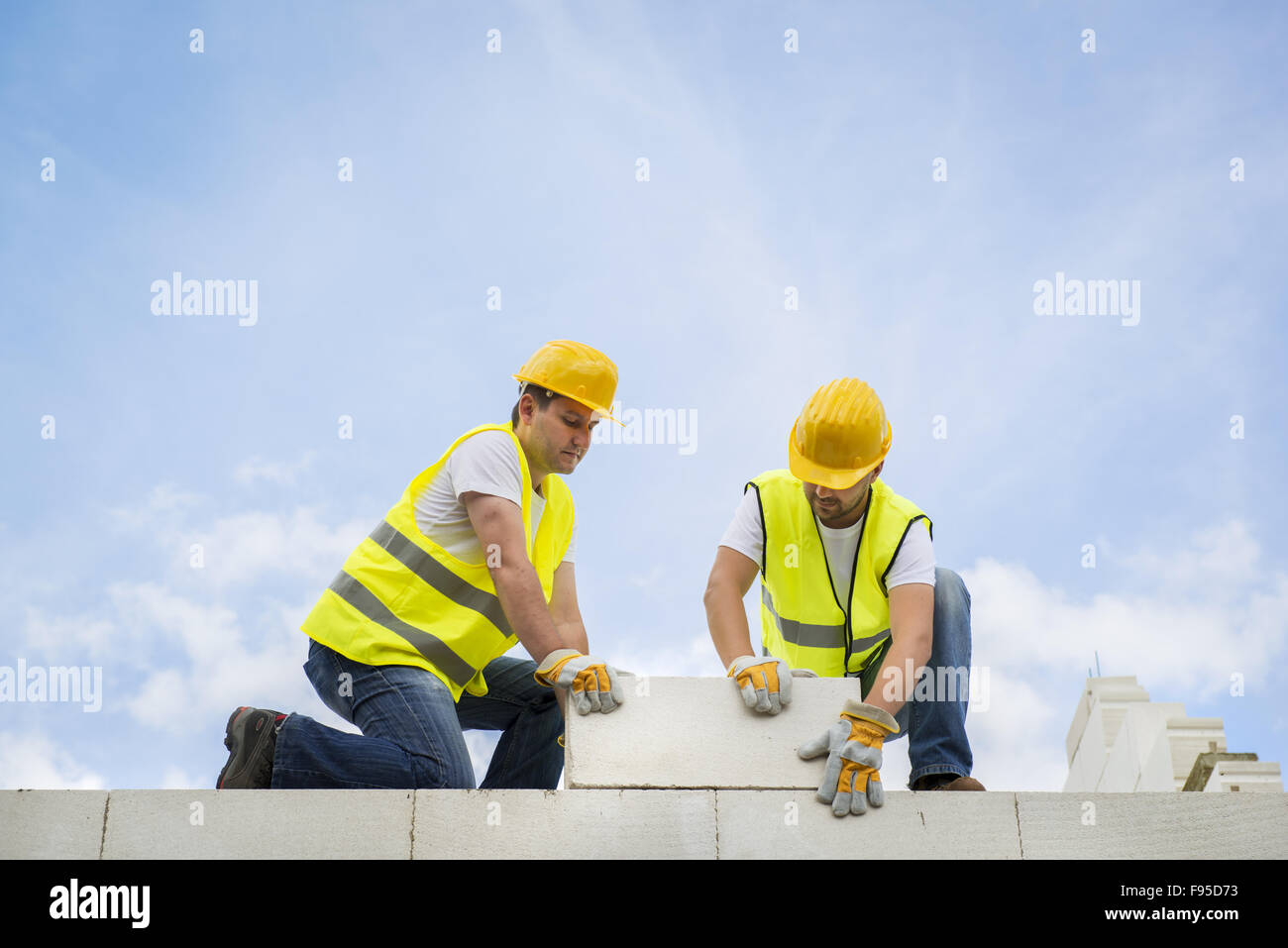 Construction Contractors building a big new home Stock Photo - Alamy