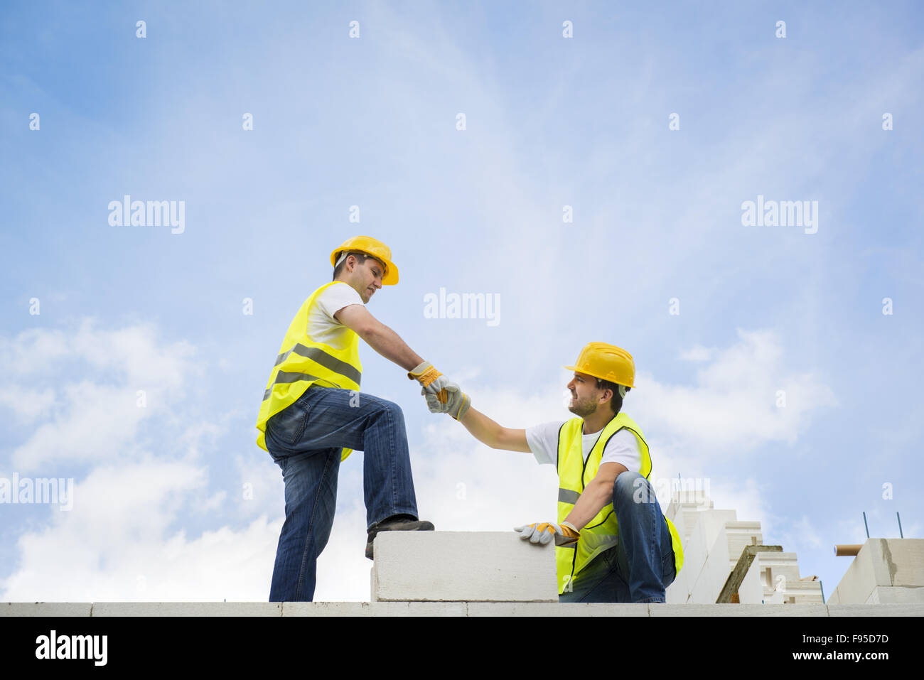 Construction Contractors building a big new home Stock Photo - Alamy