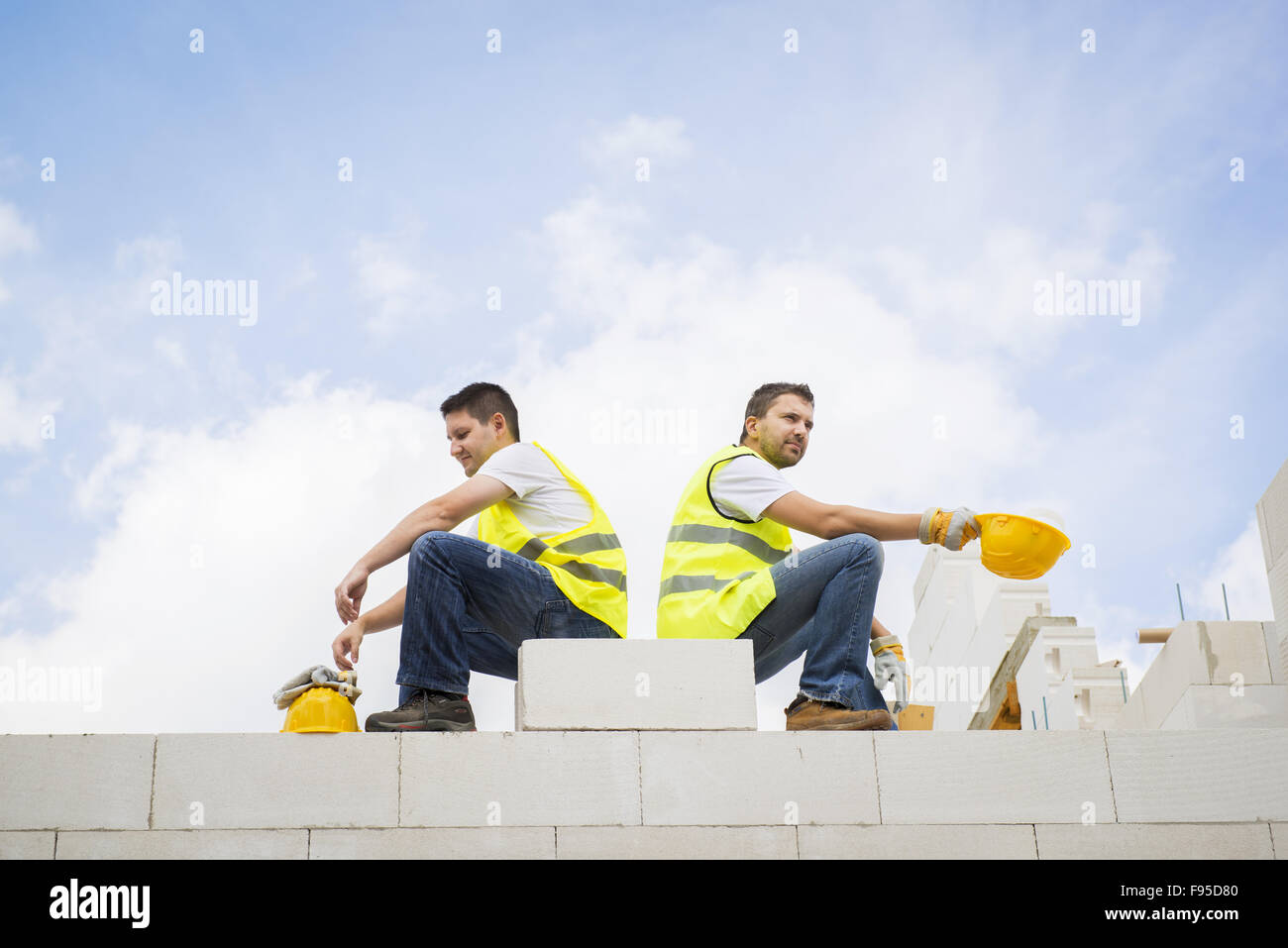 Construction Contractors building a big new home Stock Photo - Alamy