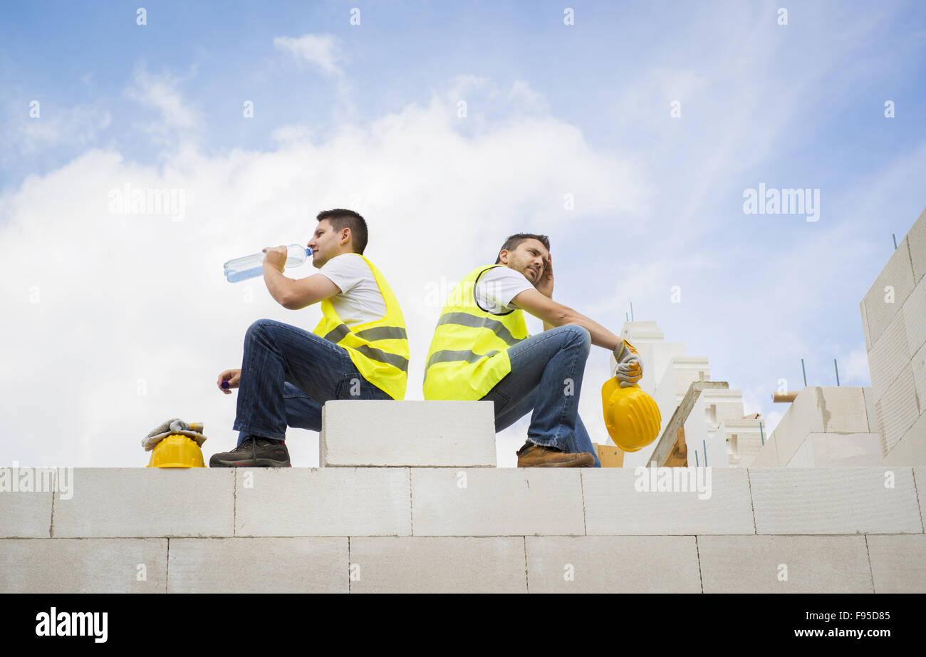 Construction Contractors building a big new home Stock Photo - Alamy
