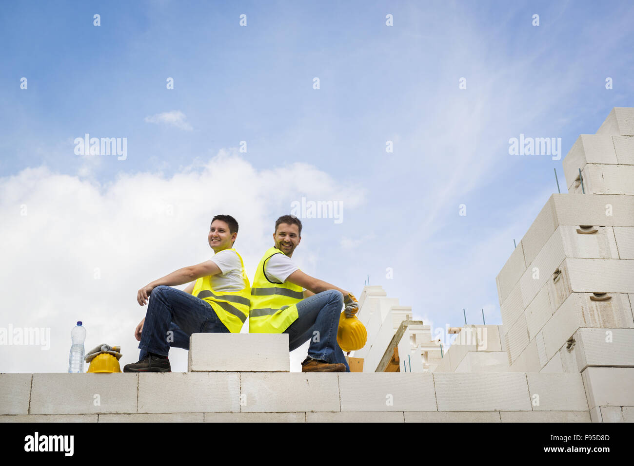Construction Contractors building a big new home Stock Photo - Alamy
