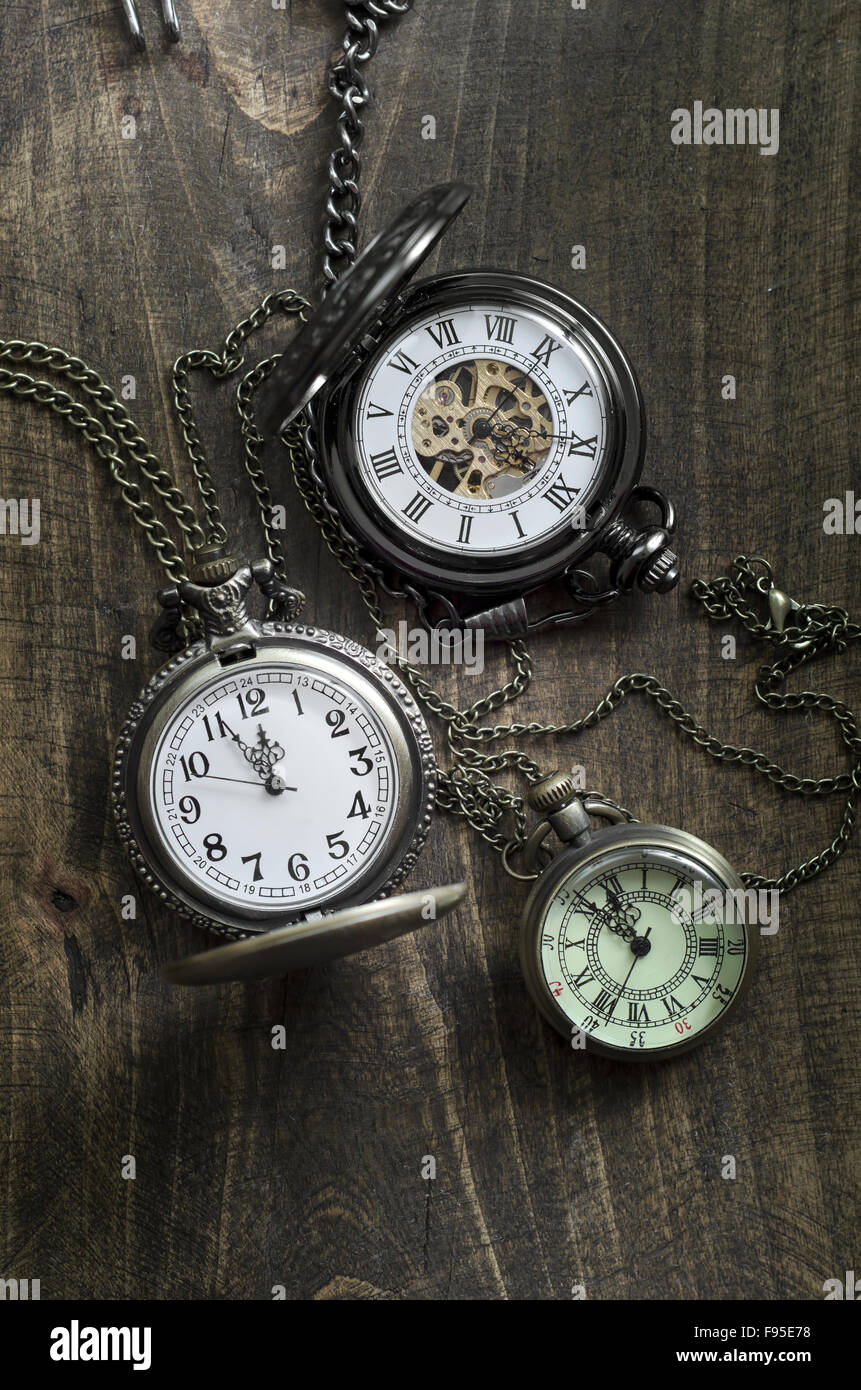 Old pocket watches on a rustic vintage wooden background Stock Photo ...