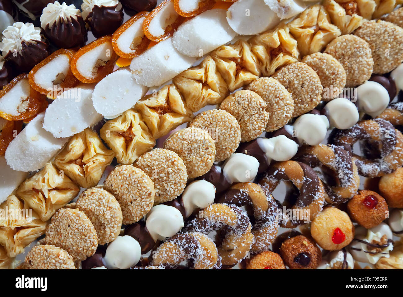 Different fancy cakes on banquet table Stock Photo - Alamy