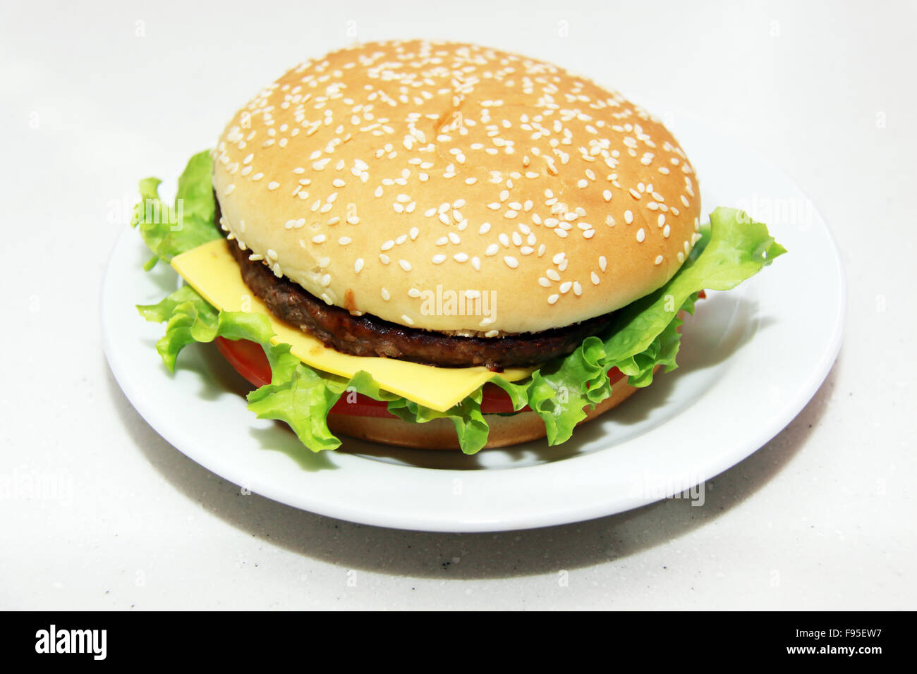Tasty hamburger isolated on white background Stock Photo - Alamy