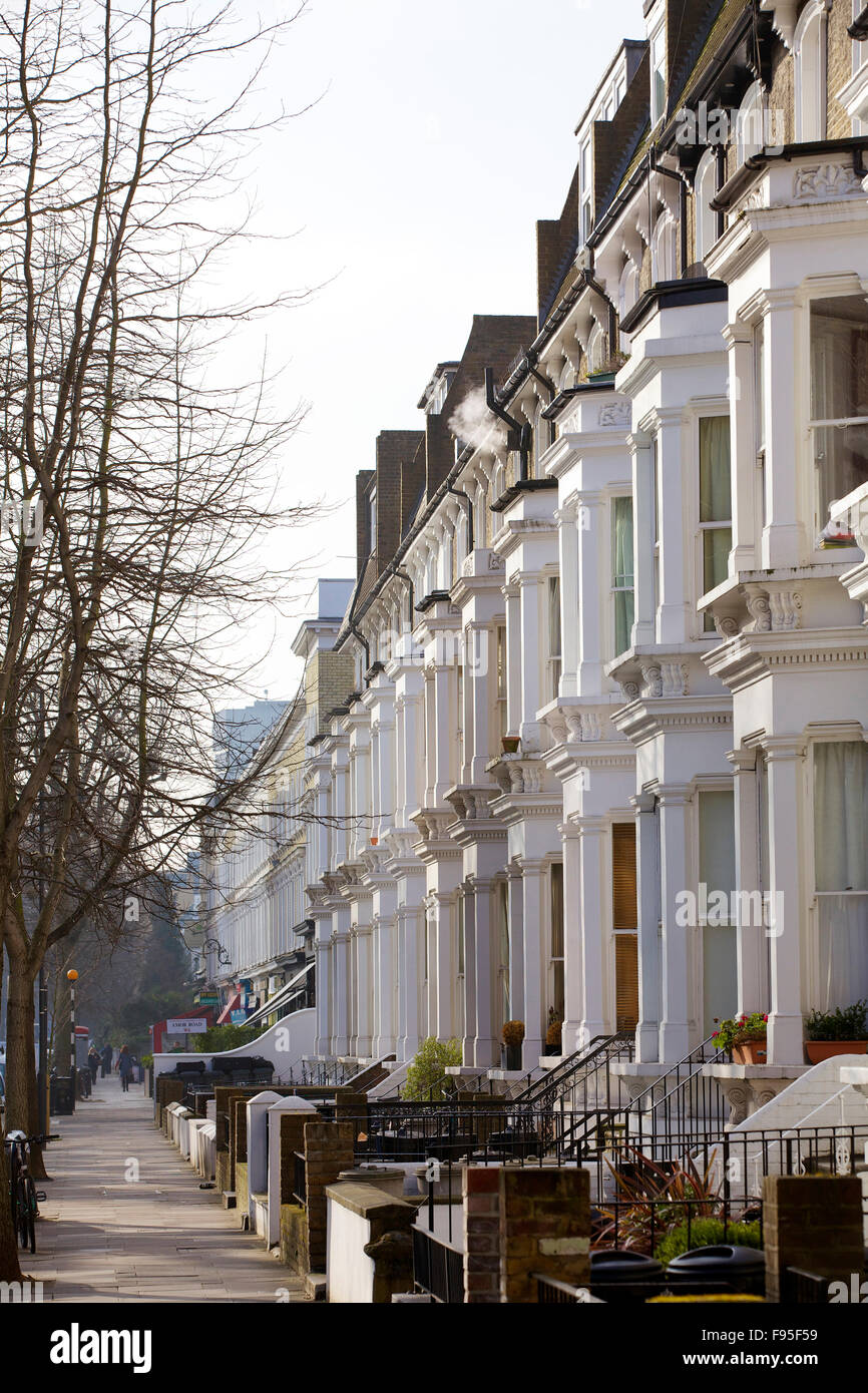 Hammersmith, London. Side view of a residential street lined with row ...