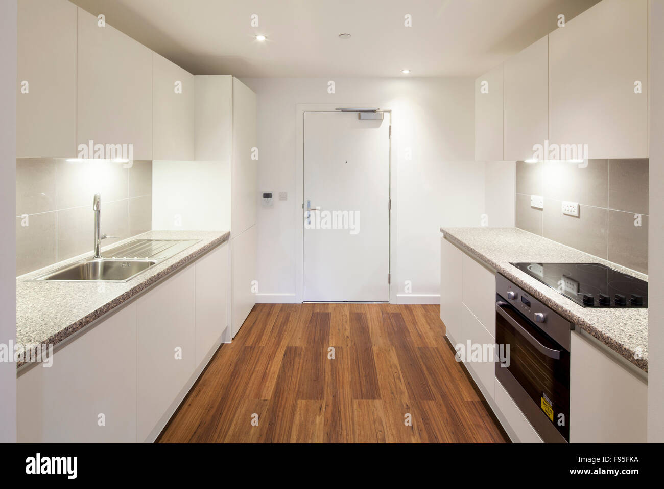 One Church Square, London, UK. View of an all white kitchen in a modern ...