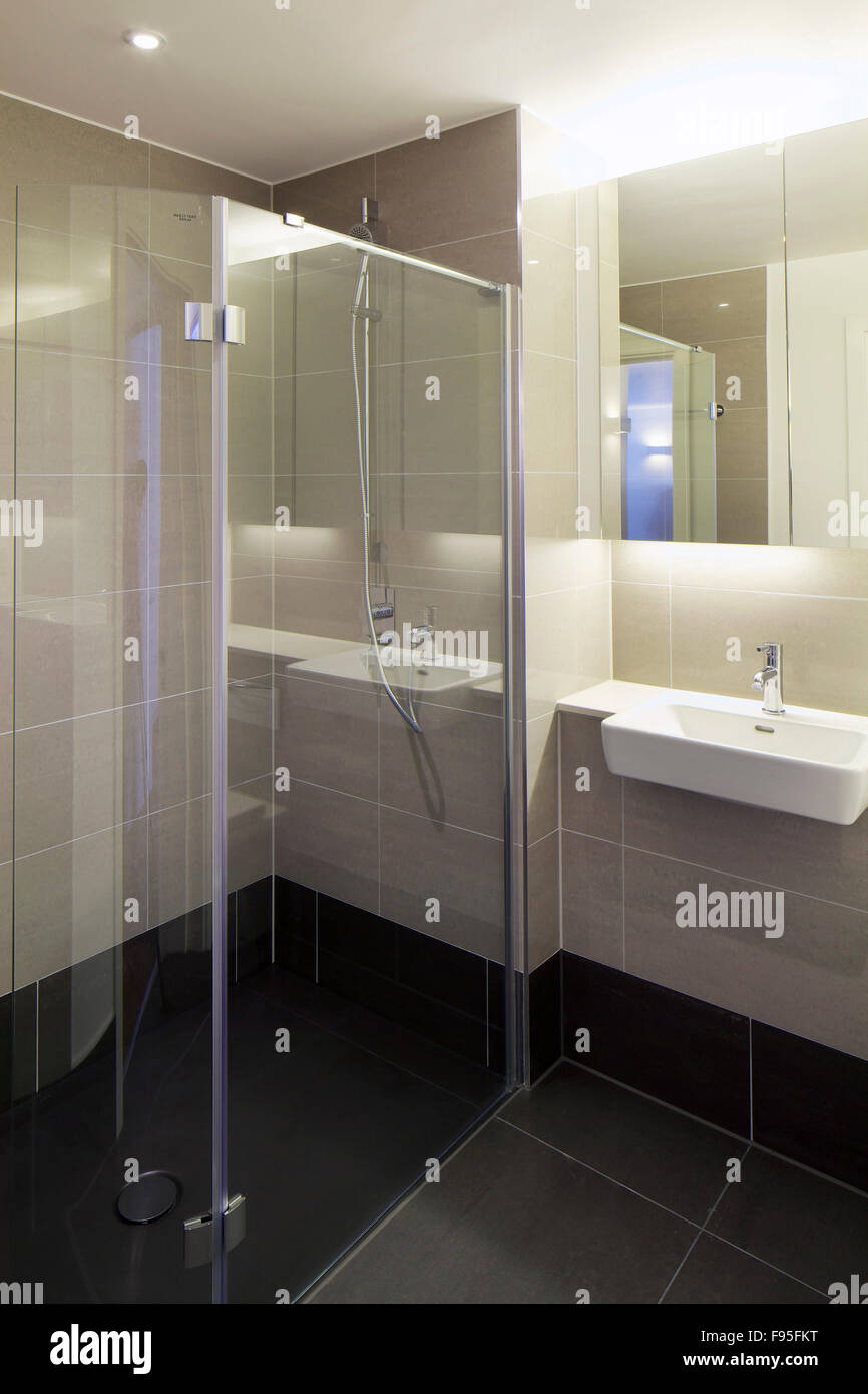One Church Square, London, UK. View of an all white bathroom with a ...