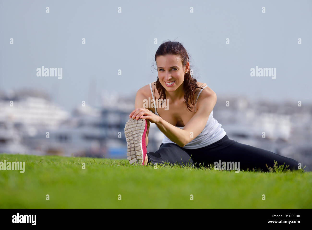 Young beautiful woman jogging and running on morning at park in the ...