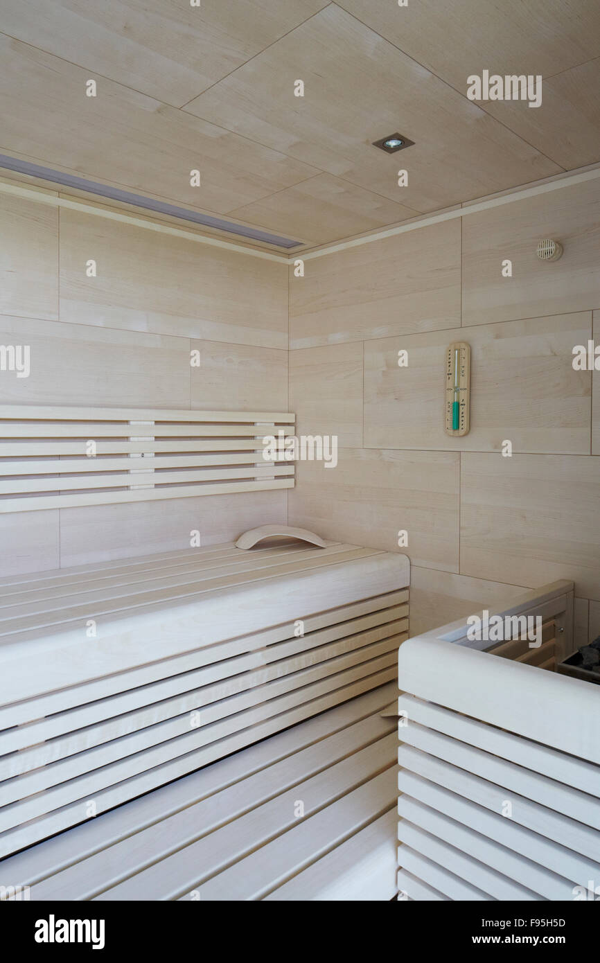Interior view of white-painted sauna in a house at the contemporary ...