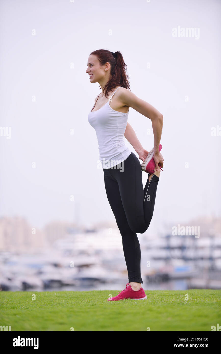 Young beautiful woman jogging and running on morning at park in the ...