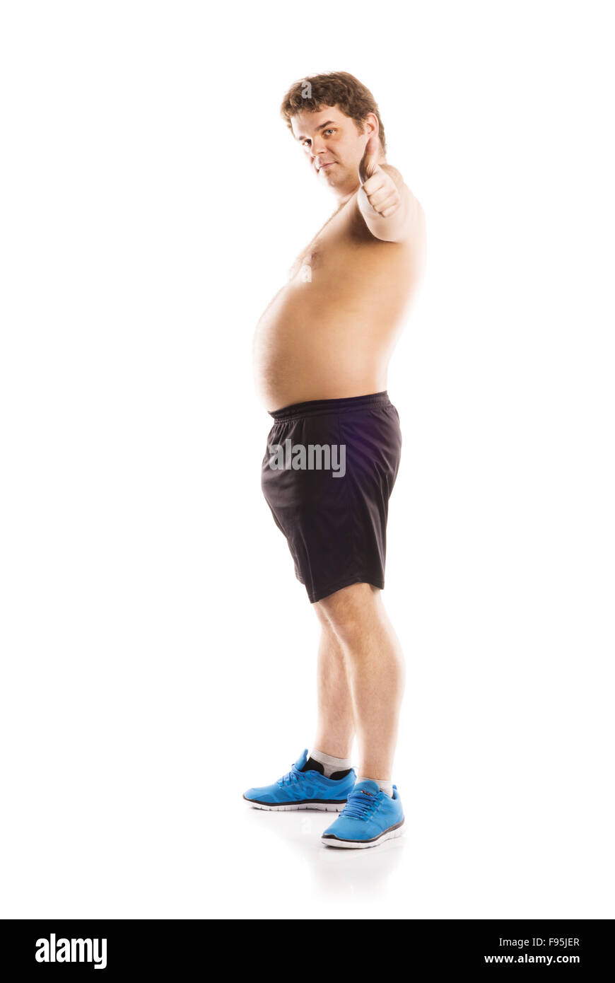 Fat fitness man is posing in studio on white background Stock Photo - Alamy