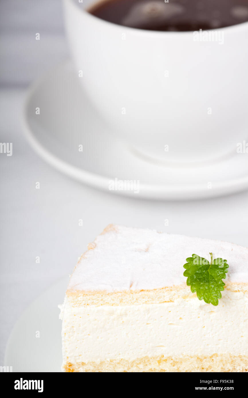 lemon balm leaf on a cream cake Stock Photo - Alamy