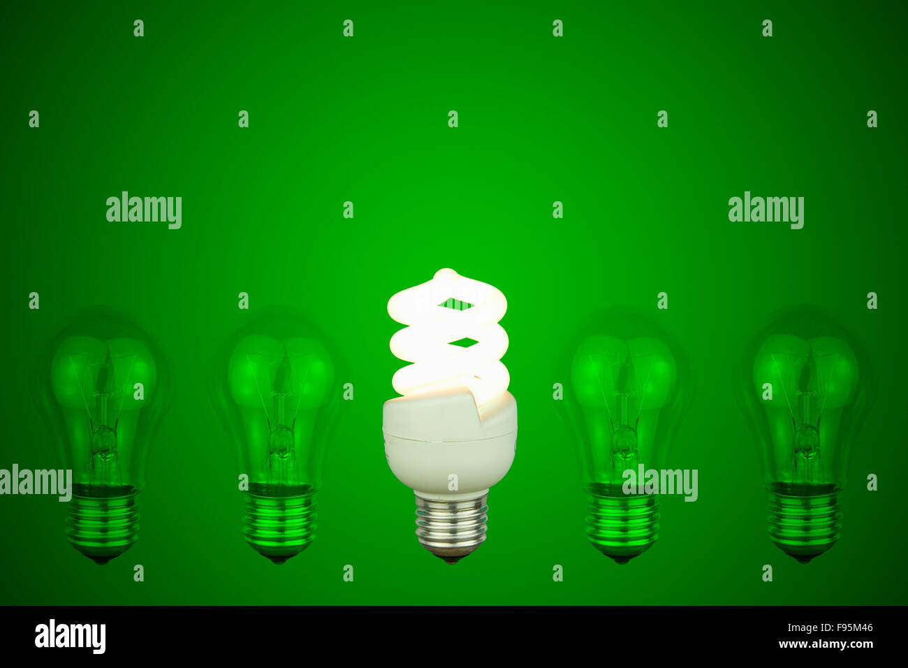 light bulbs with centre Low energy light bulb glowing Stock Photo - Alamy