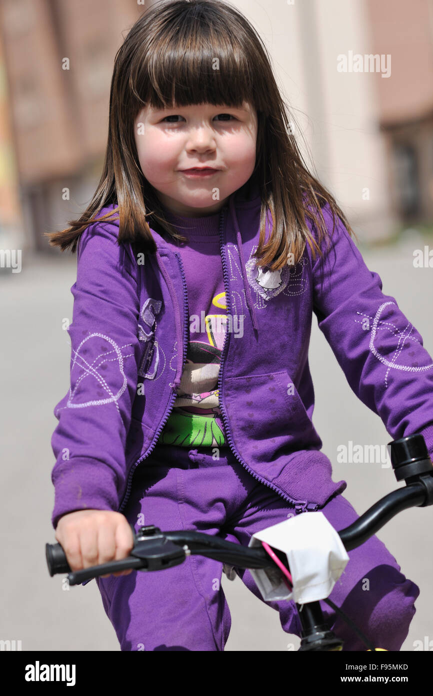 cute little girl learn to drive bicyle at sunny day Stock Photo - Alamy