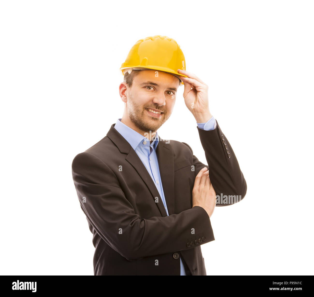 Young engineer with yellow helmet is isolated on white background Stock ...