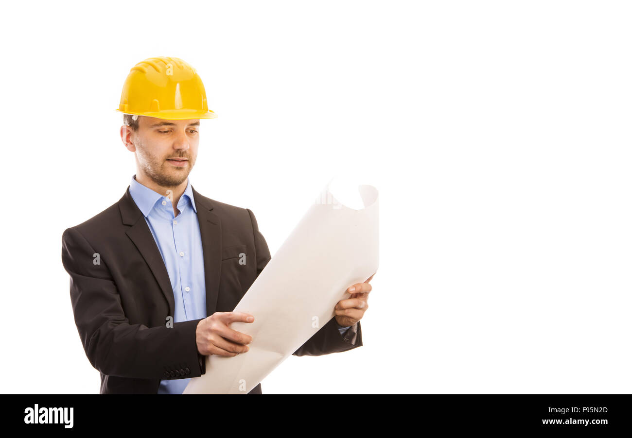 Young engineer with yellow helmet is isolated on white background Stock ...
