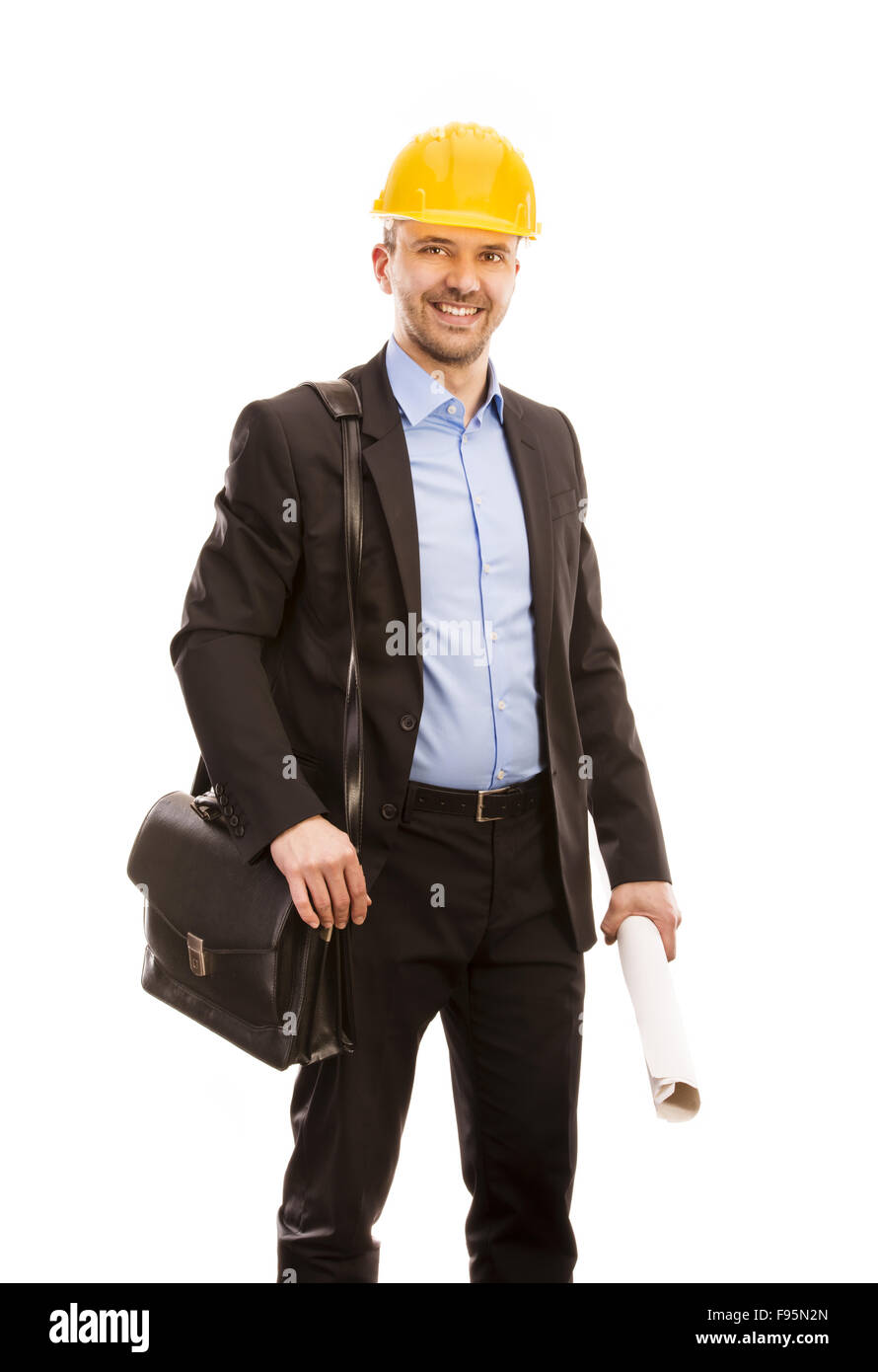 Young engineer with yellow helmet is isolated on white background Stock ...