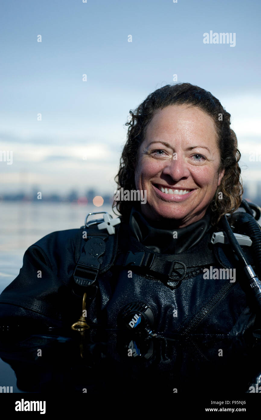 Scuba diver portrait with city background Stock Photo - Alamy