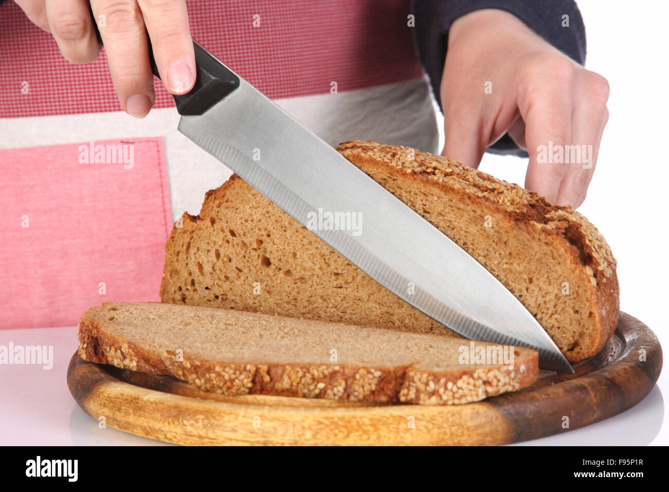 cutting bread with knife Stock Photo - Alamy