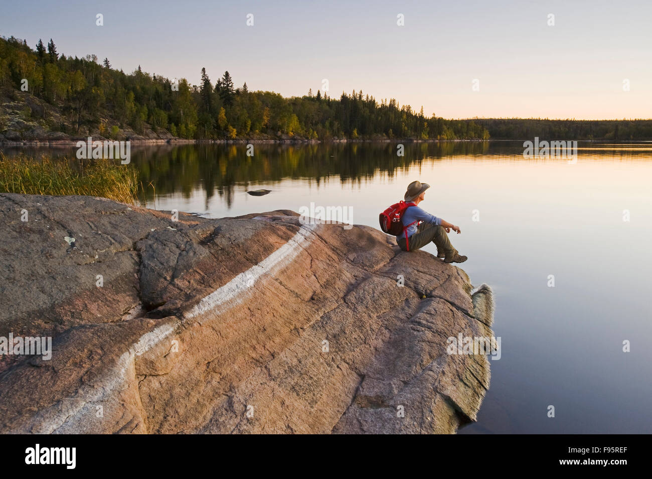 Hiker on the rock hi-res stock photography and images - Alamy