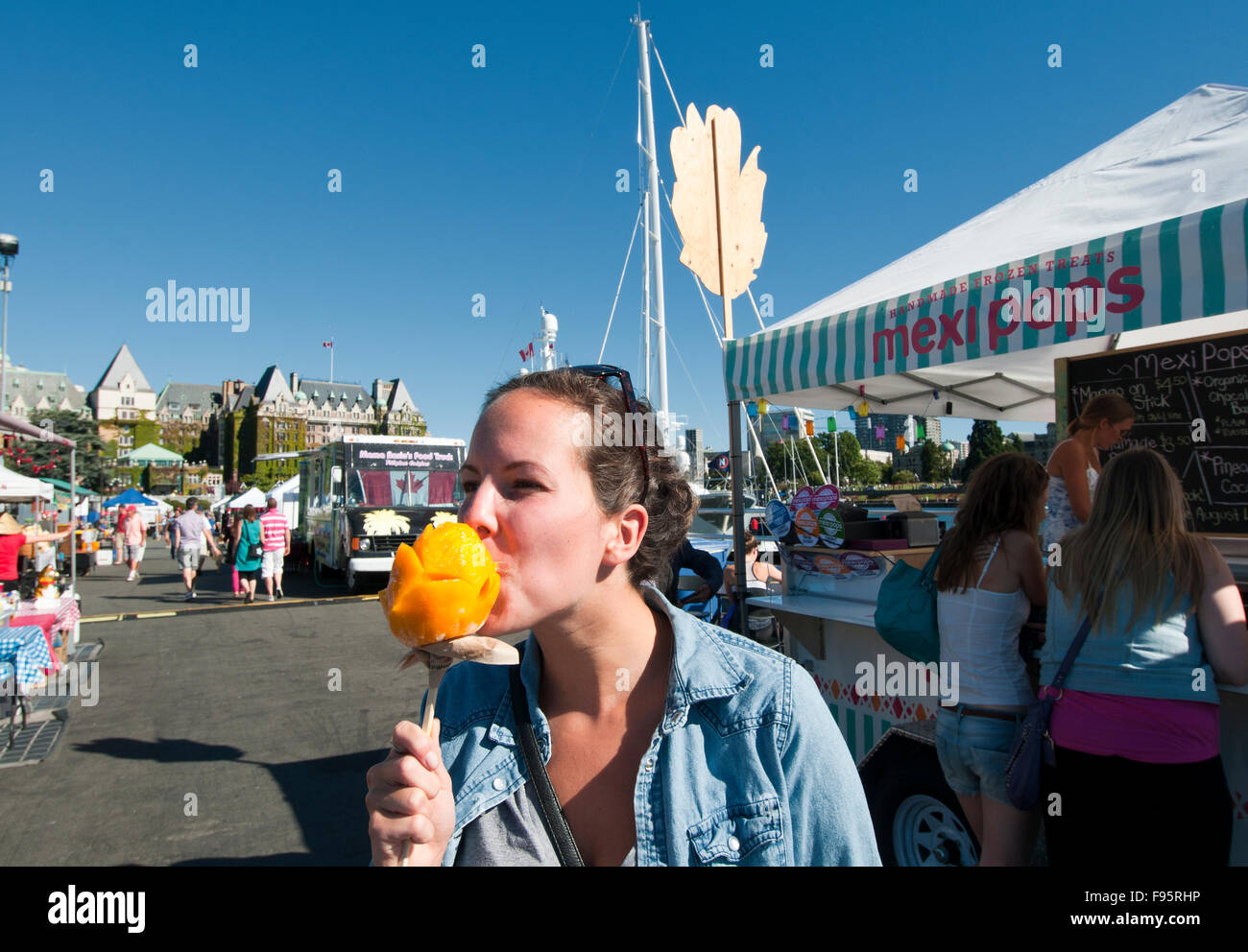 Taylor enjoys a frozen mango at the Ship Point market on the Inner ...