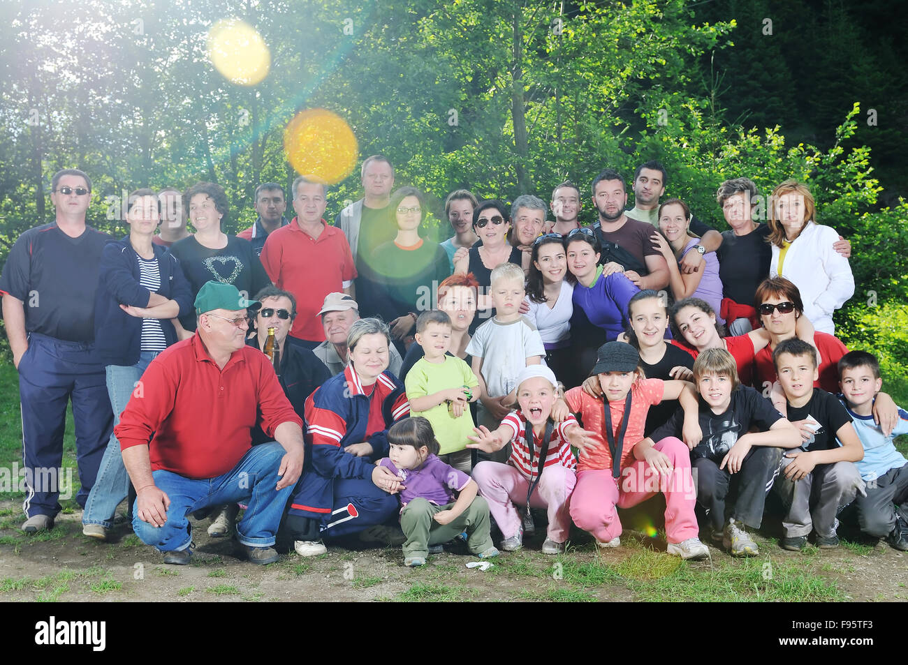 large family group portrait outdoor in nature at beautiful summer day ...