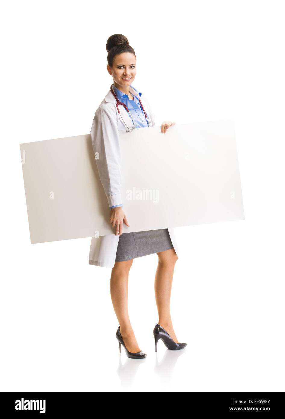 Smiling medical doctor woman with stethoscope. Full body portraits ...